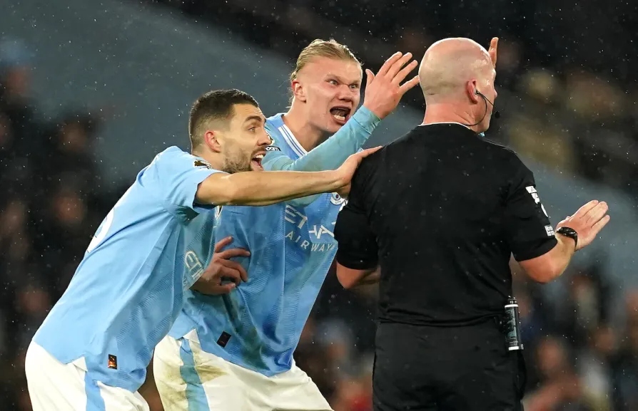 Manchester City charged by FA after players surround referee against ...